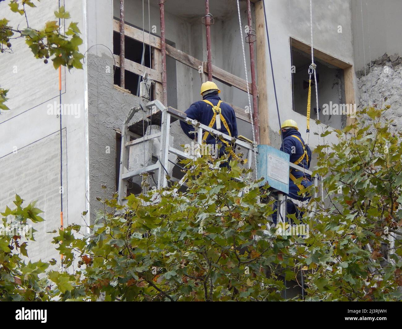 Construction workers in a building under construction Stock Photo - Alamy