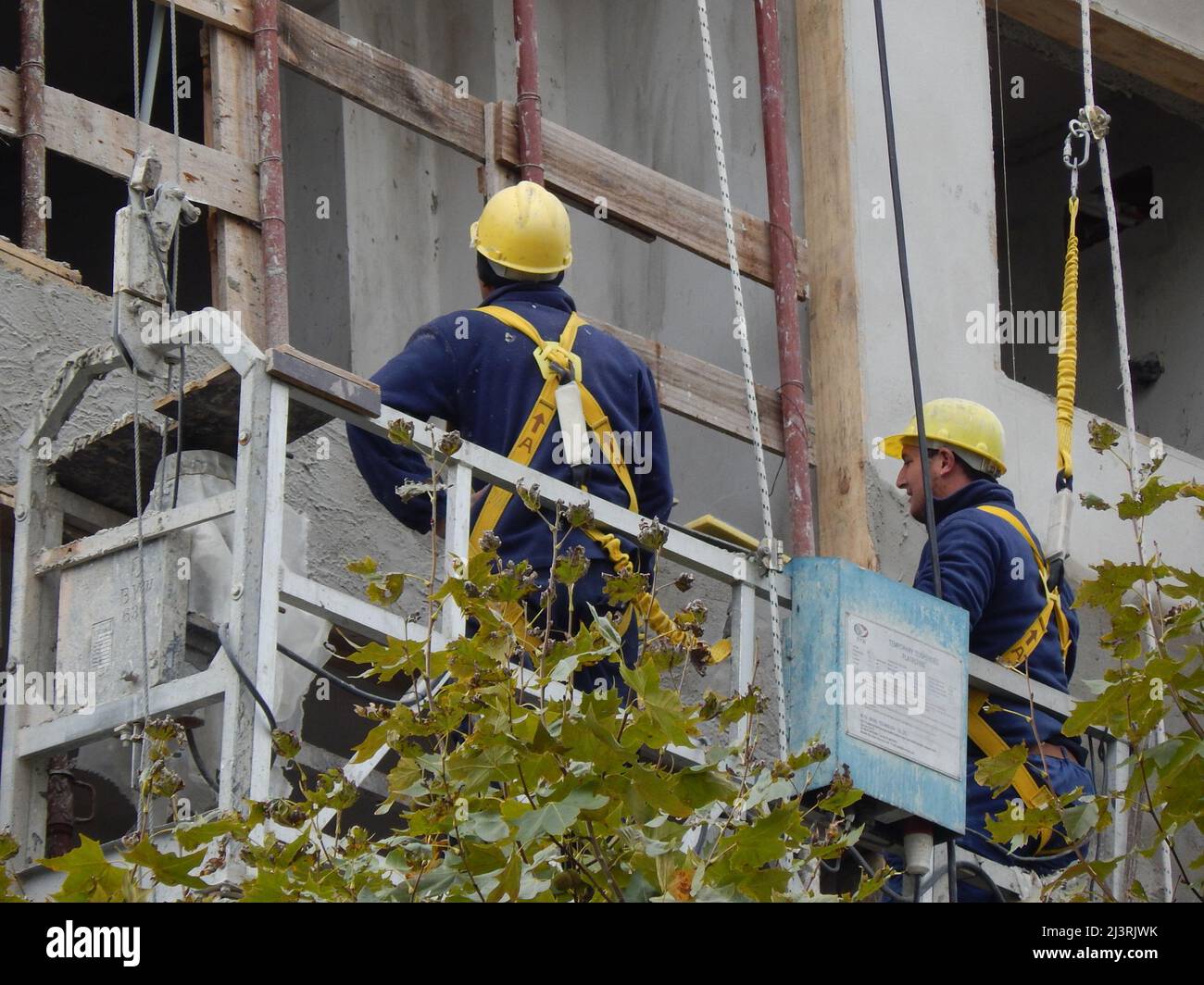 Construction workers in a building under construction Stock Photo - Alamy