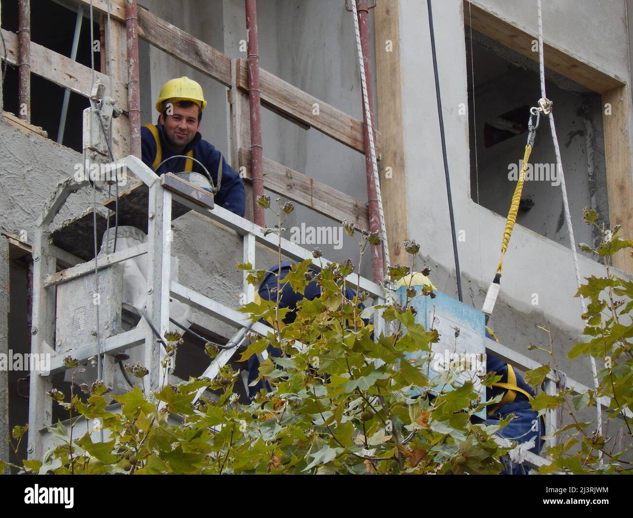 Construction workers in a building under construction Stock Photo - Alamy