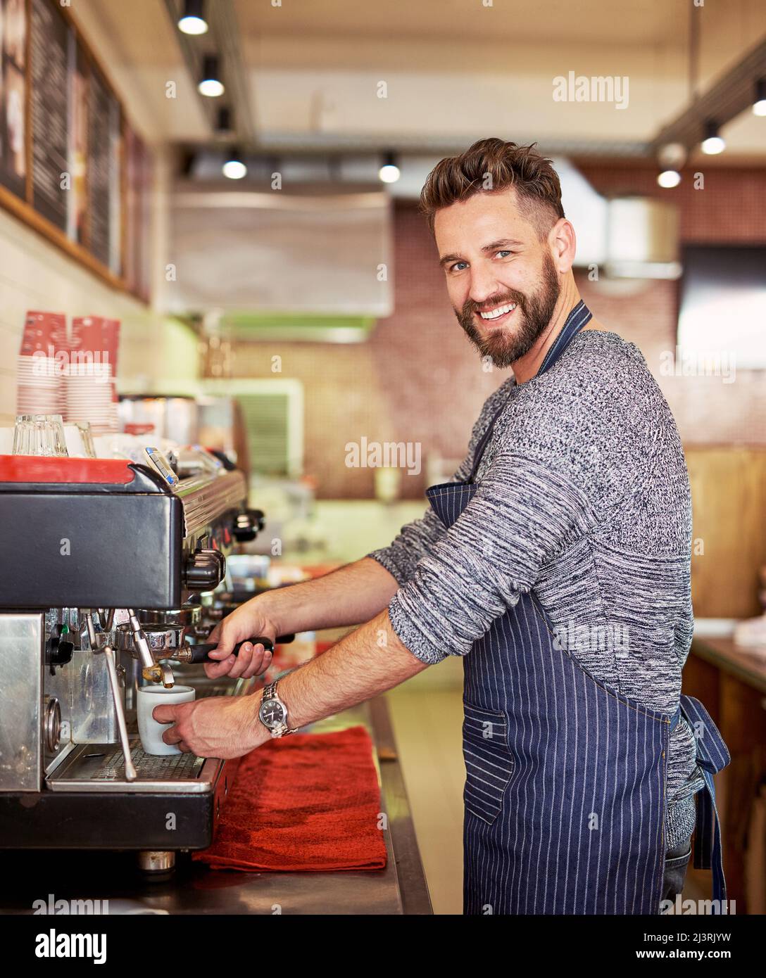 Coffee so good youll keep coming back for more. Portrait of a barista ...