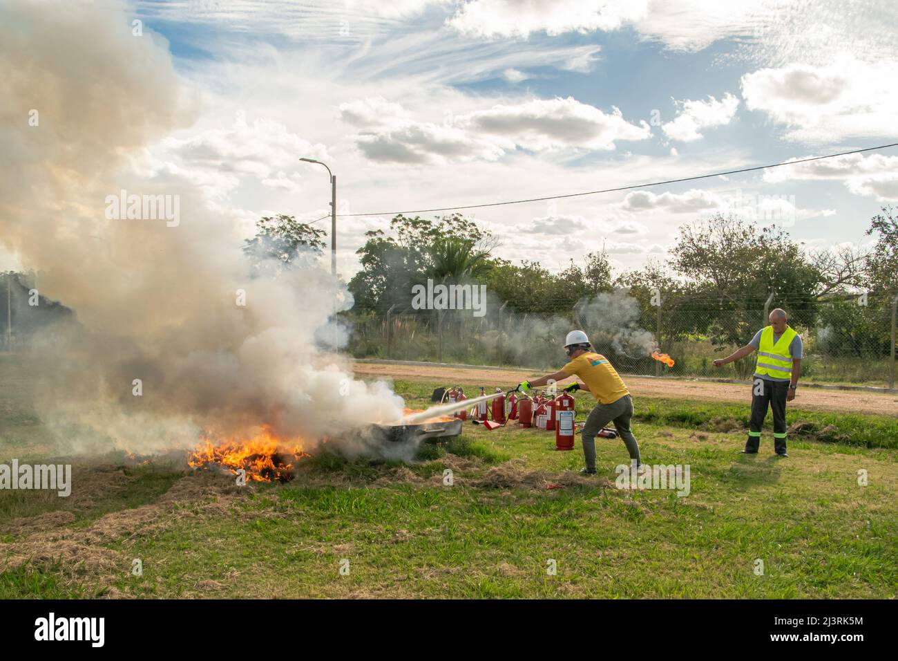 Training workers in fire fighting Stock Photo - Alamy