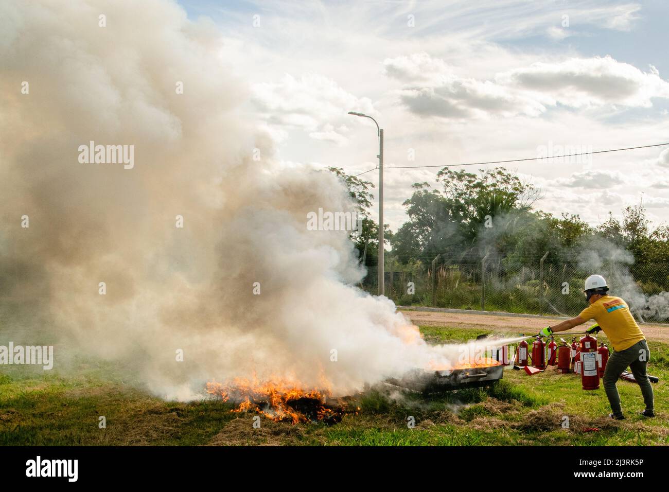 Training workers in fire fighting Stock Photo - Alamy