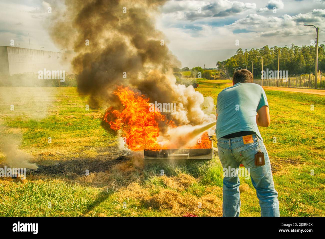 Training workers in fire fighting Stock Photo - Alamy
