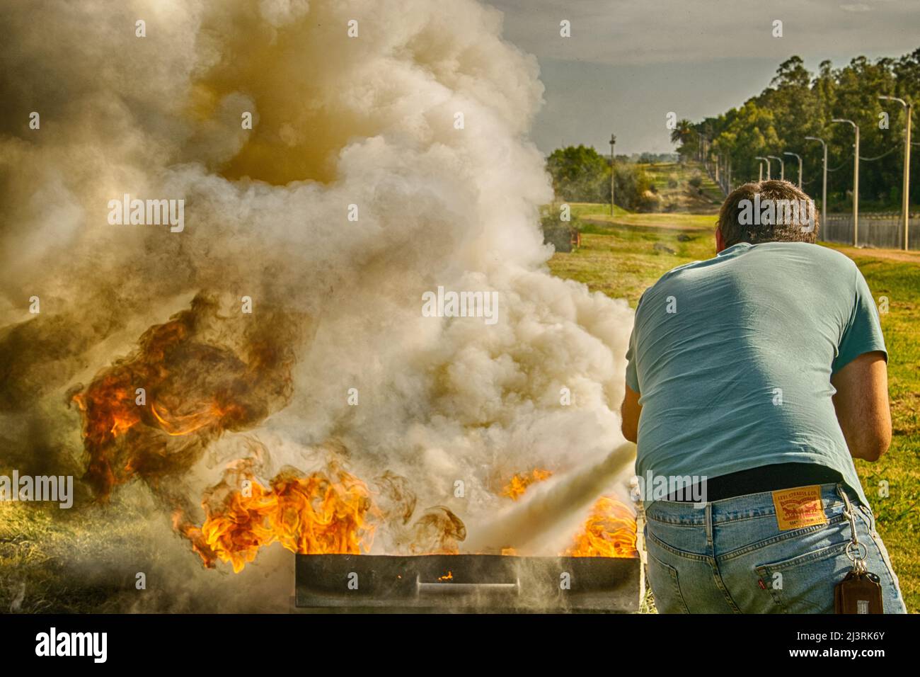 Training workers in fire fighting Stock Photo - Alamy