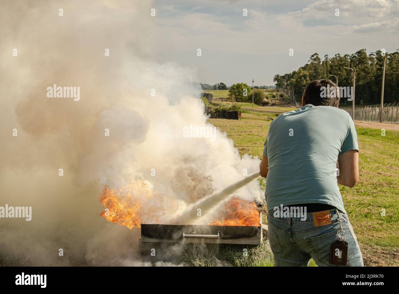 Training workers in fire fighting Stock Photo - Alamy