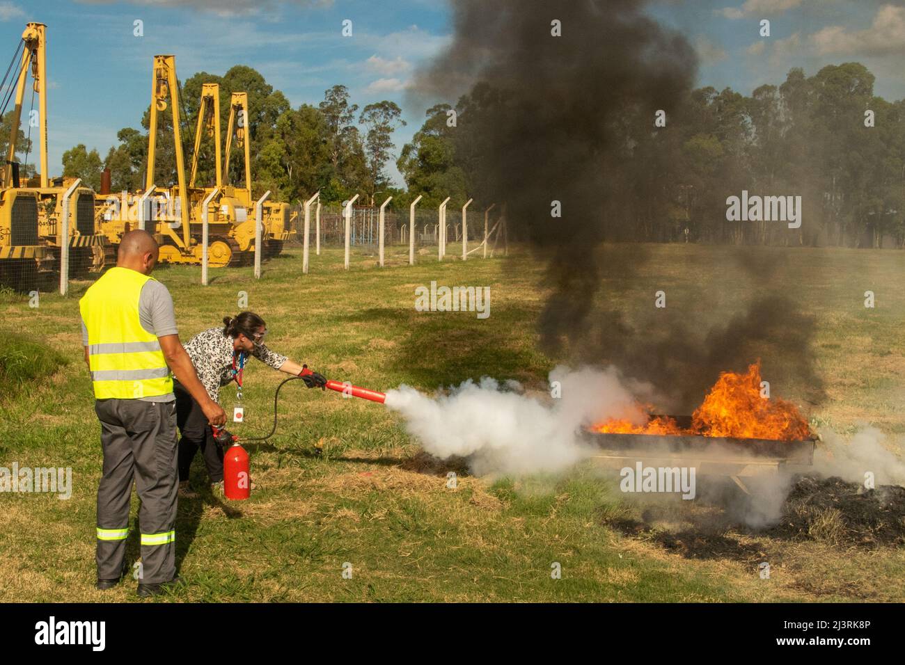 Training workers in fire fighting Stock Photo - Alamy