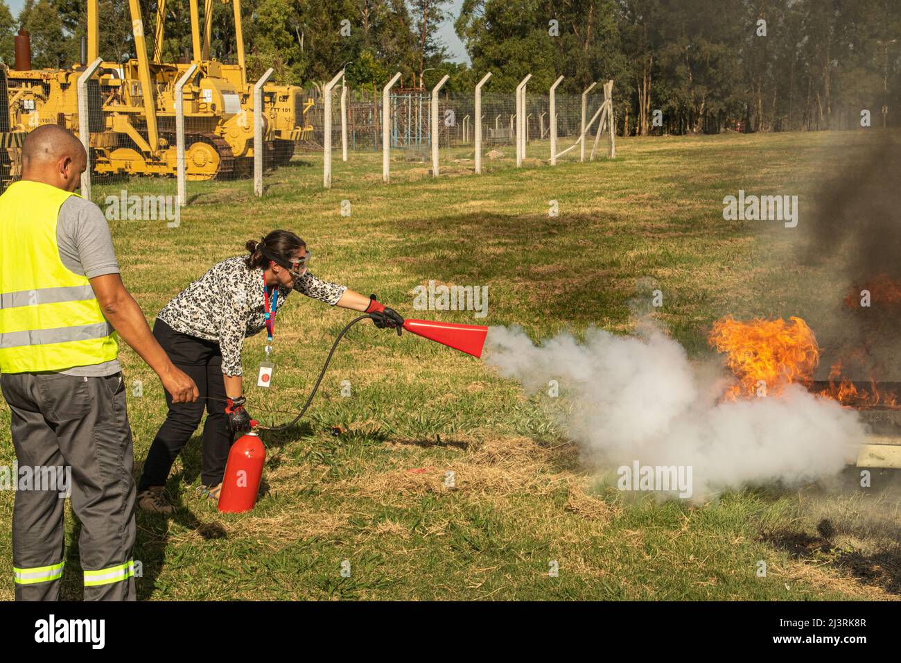 Training workers in fire fighting Stock Photo - Alamy