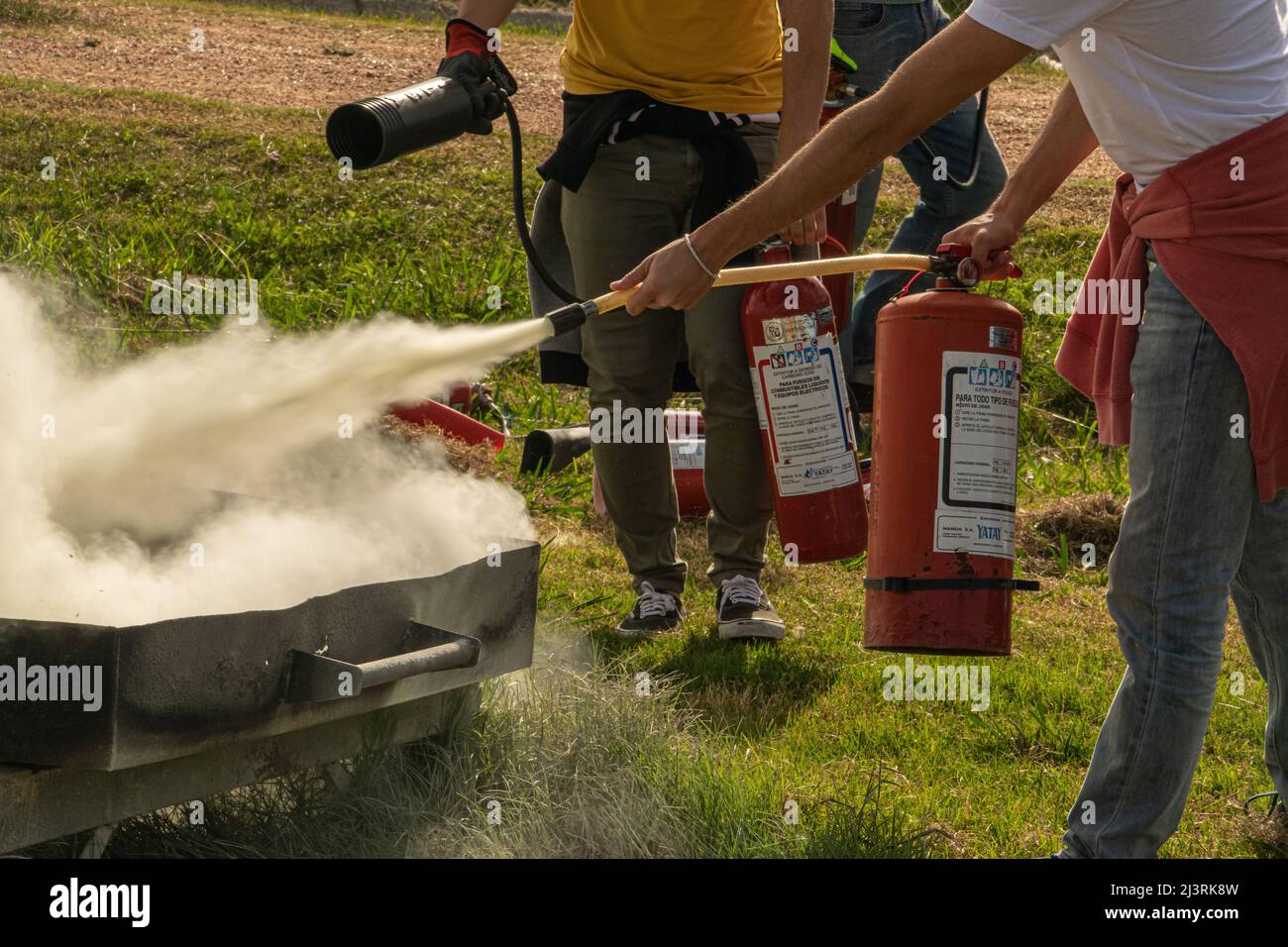 Training workers in fire fighting Stock Photo - Alamy