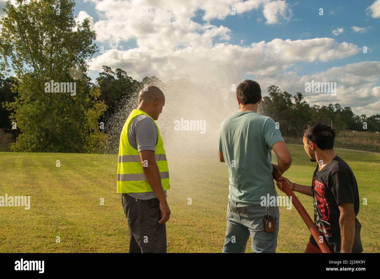Workers training fire fighting Stock Photo - Alamy