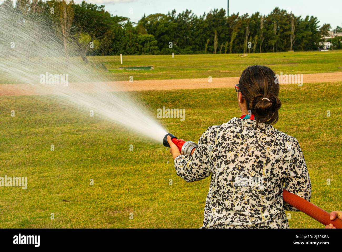Workers training fire fighting Stock Photo - Alamy
