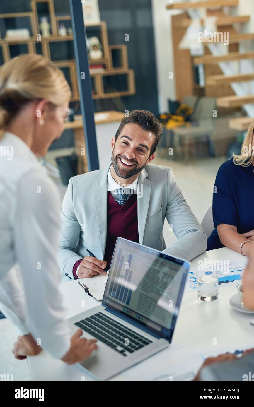 Inspiring great teamwork together. Cropped shot of a businessman in a ...