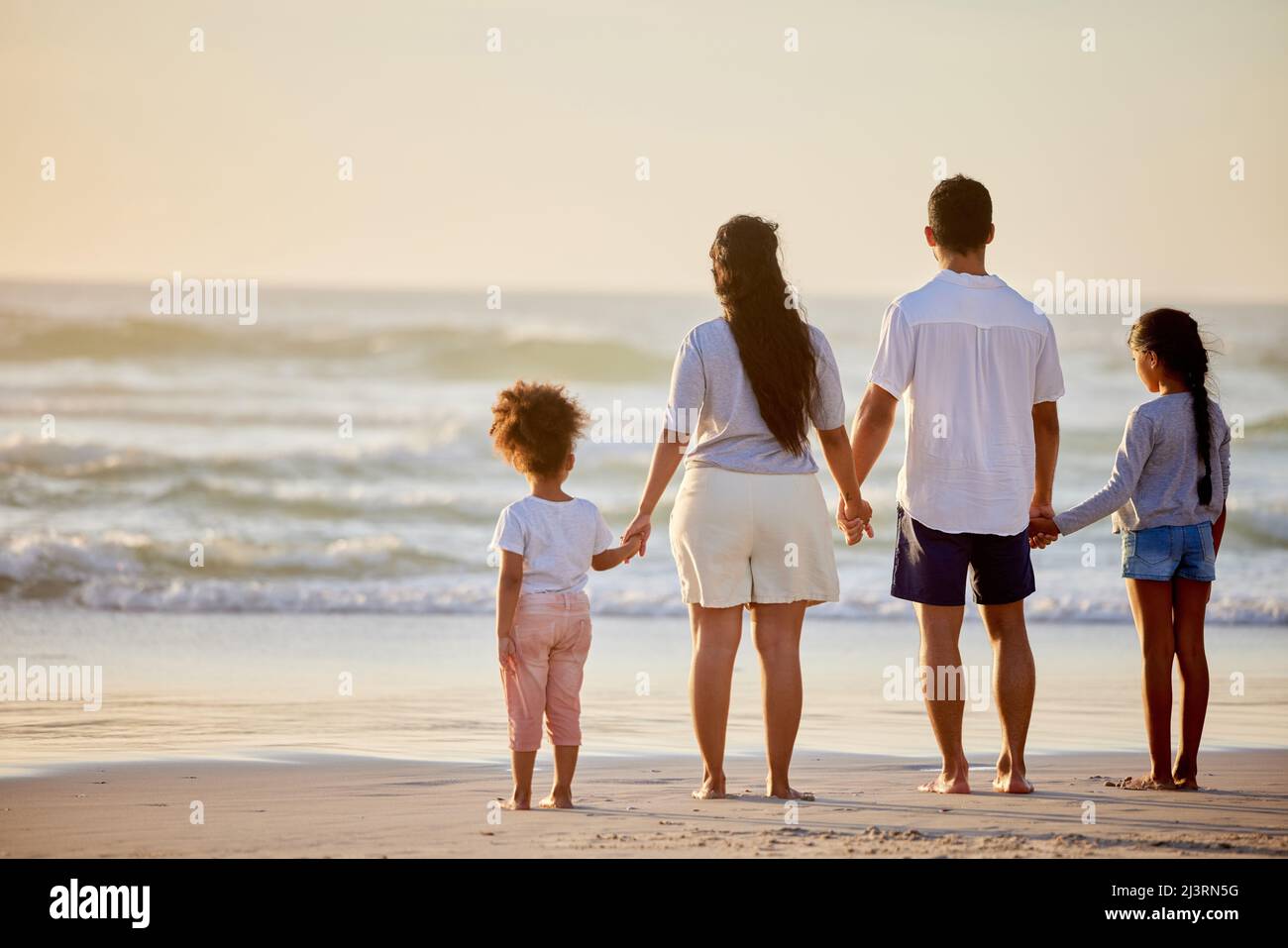 Family watching a sunset hi-res stock photography and images - Alamy