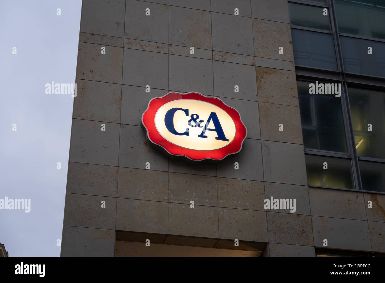 Illuminated sign of the fashion label C und A. Famous german retailer ...