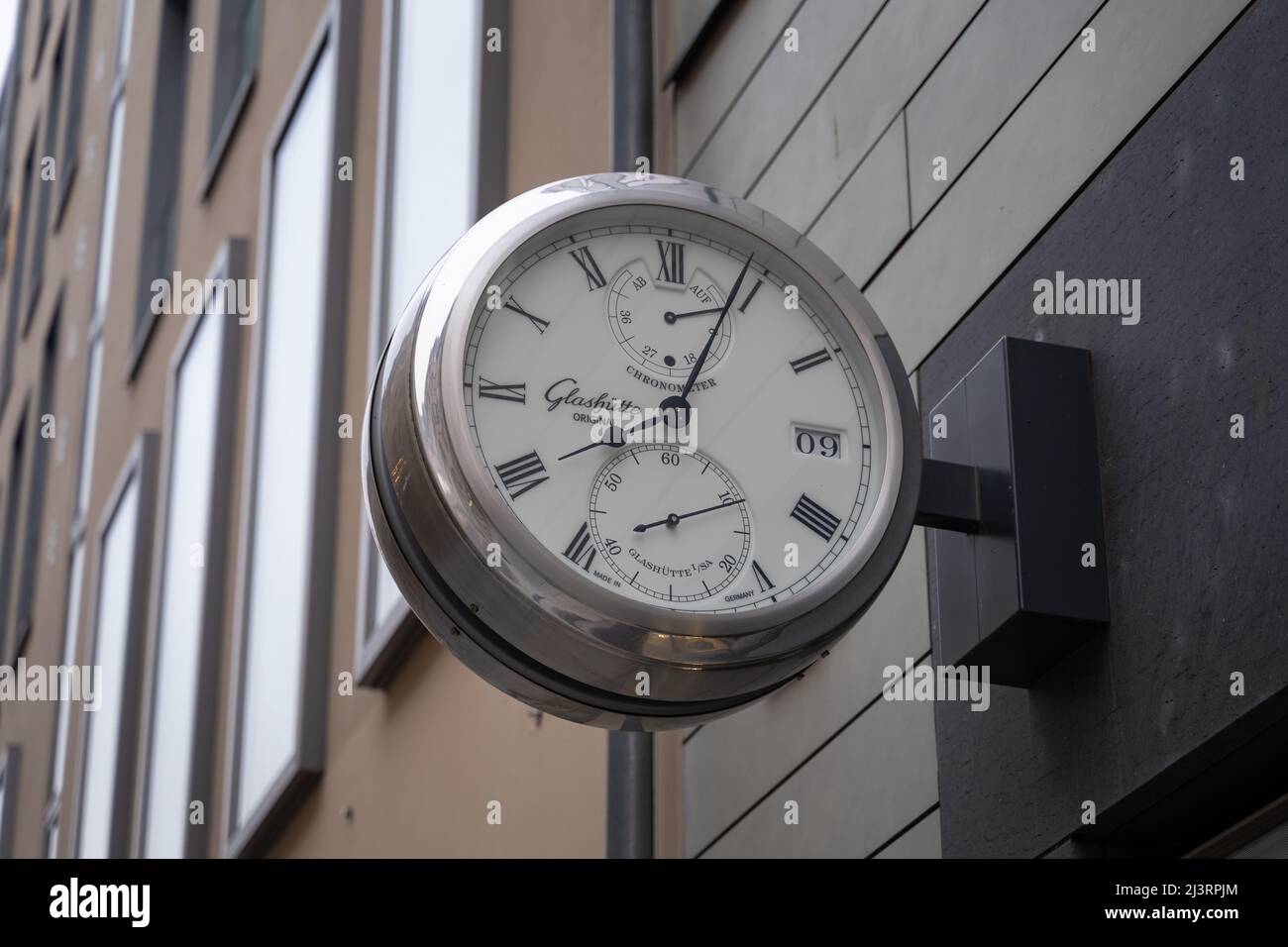 Big Glashütte advertisement clock on facade. Decoration of a store with ...