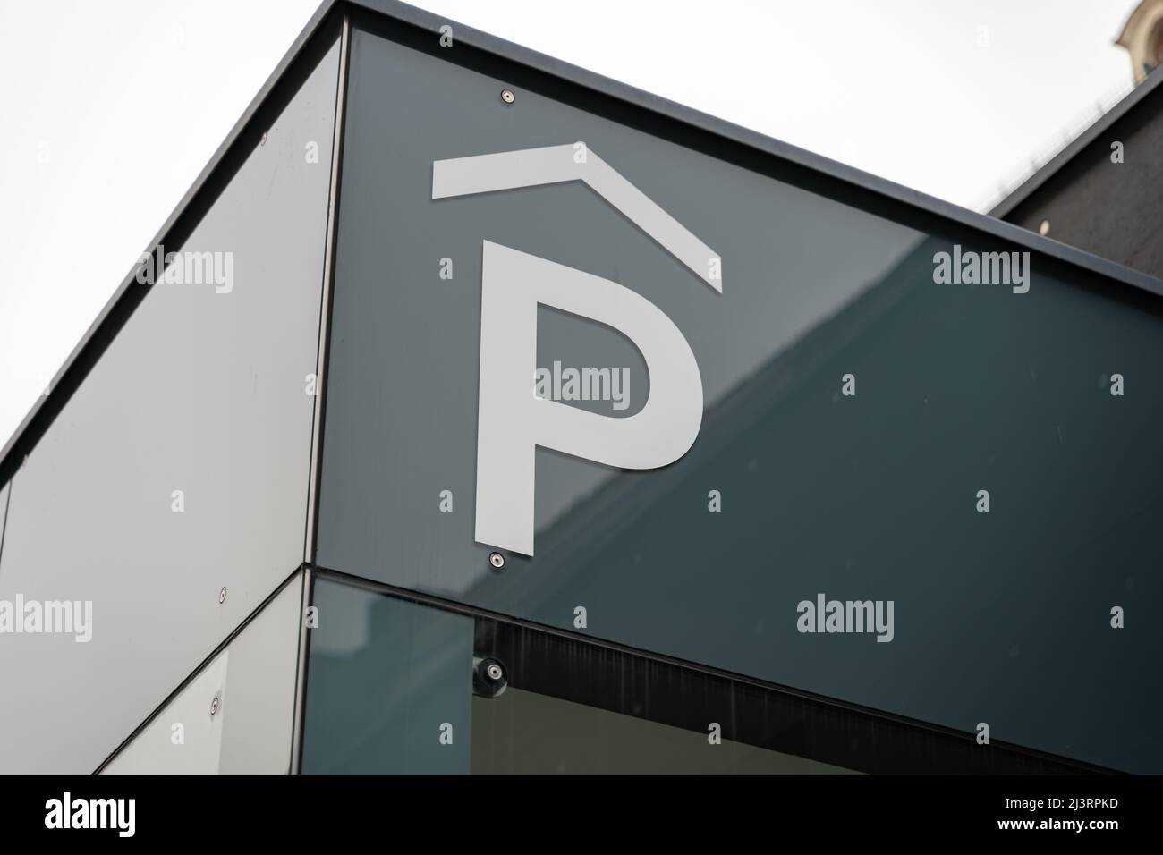Sign of a car park on the facade of a building. Parking lot in a German ...