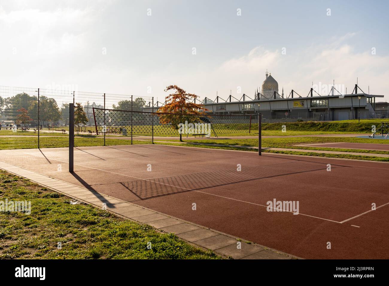 Outdoor sports ground for ball games with a net in the middle of the ...