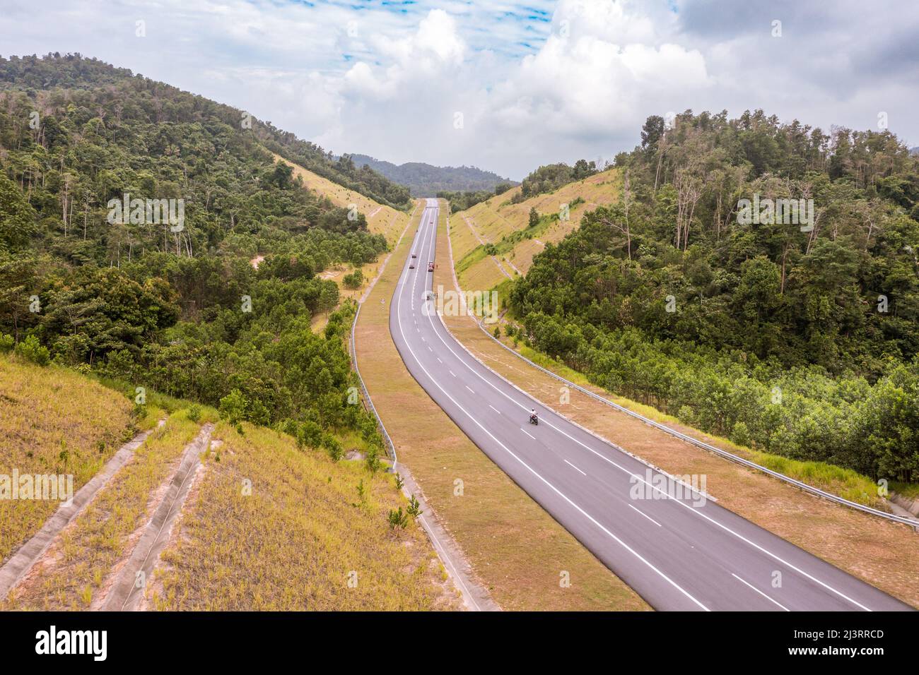 Aerial view of the new popular Temiang Pantai Highway. The highway went ...