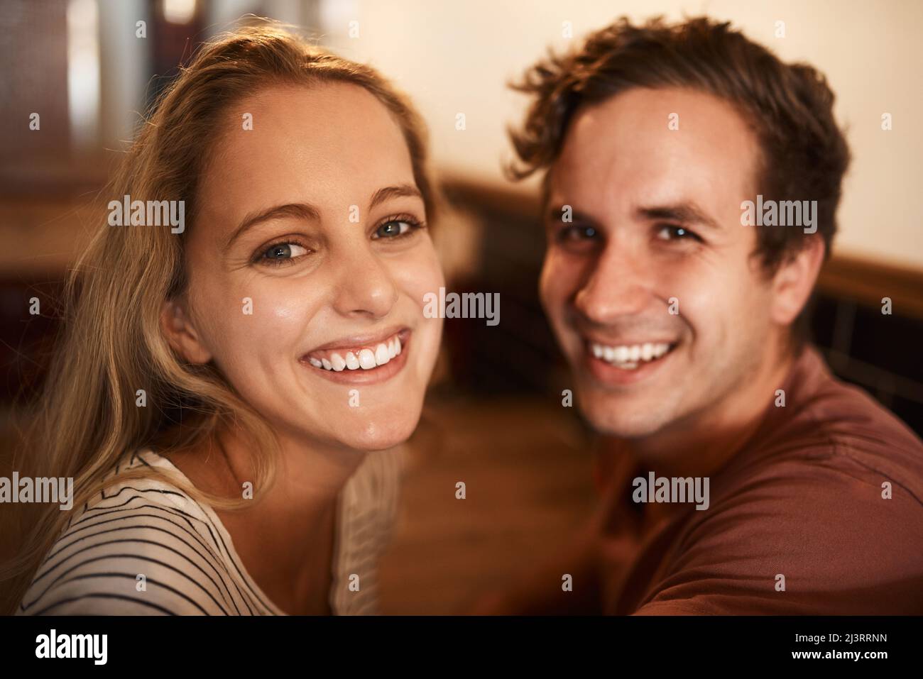 This is our favourite hangout. Portrait of a happy young couple ...