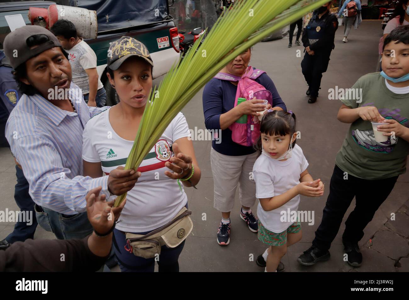 Artisans make palm figures such as crucifixes, fish, hearts and ...