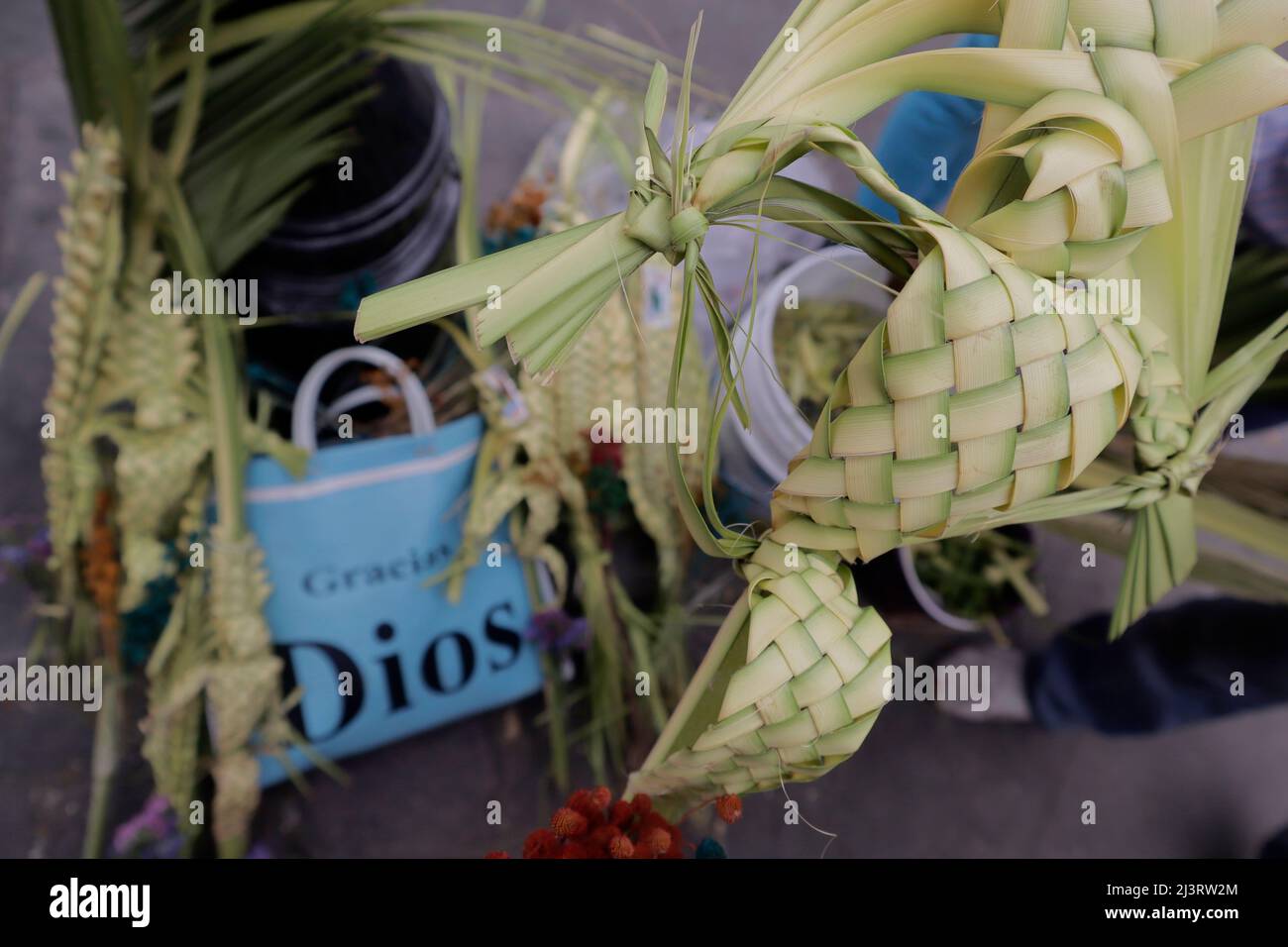 Artisans make palm figures such as crucifixes, fish, hearts and ...