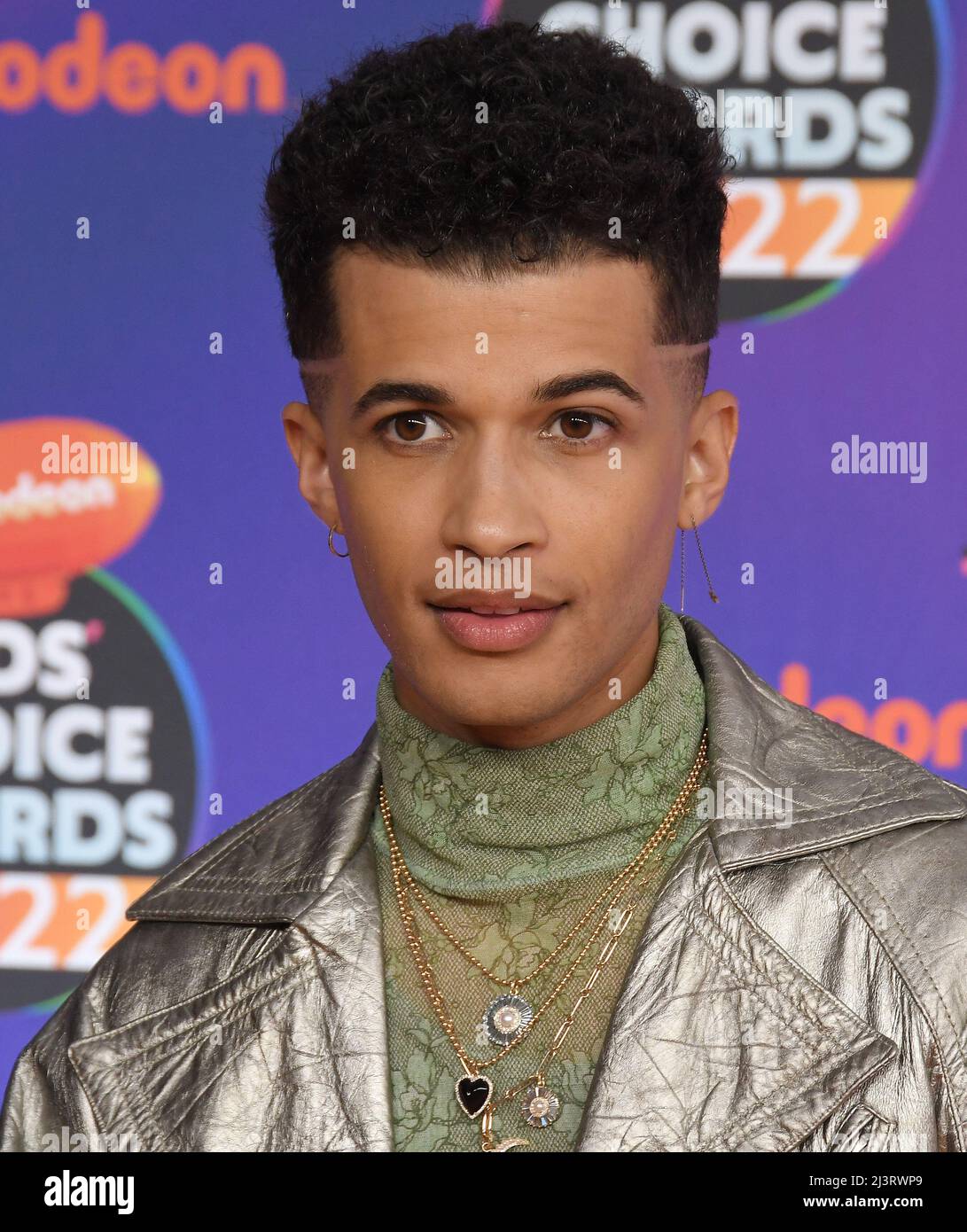 Jordan Fisher arrives at the 2022 Nickelodeon Kid's Choice Awards held ...