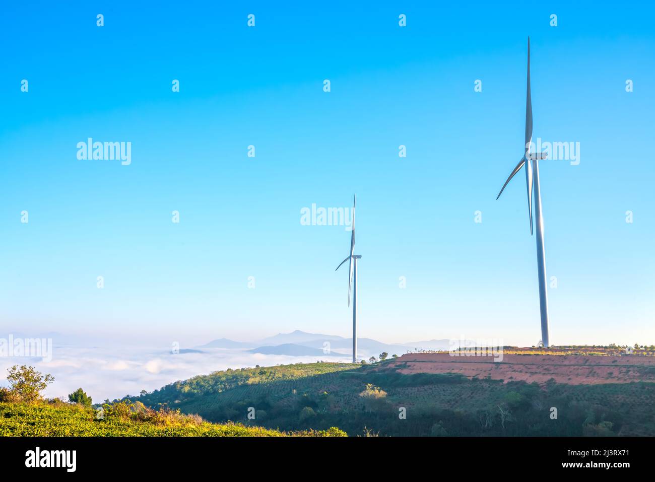 Wind turbines on the top of the hill in the morning. This is a clean ...