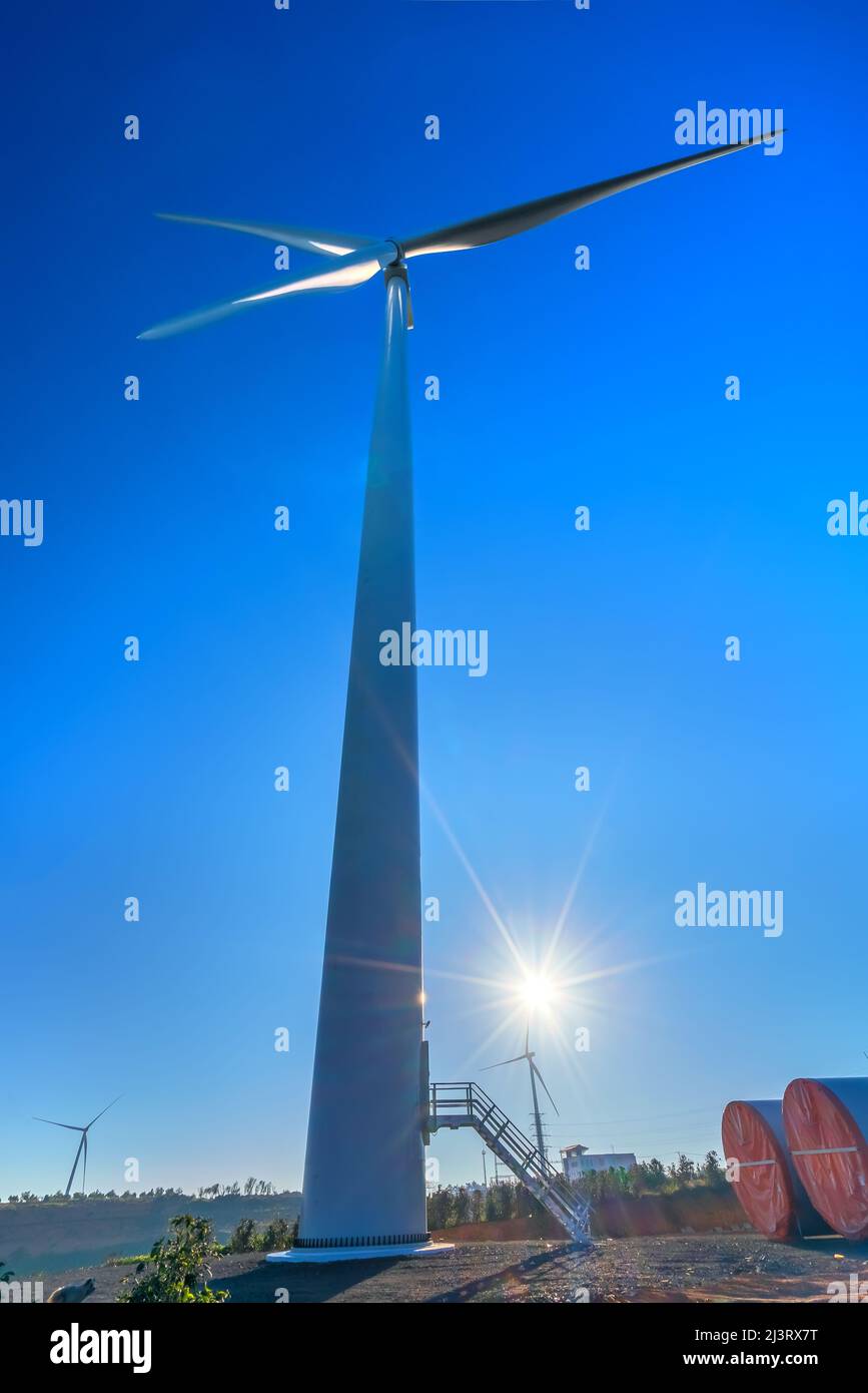 Wind turbines on the top of the hill in the morning. This is a clean ...