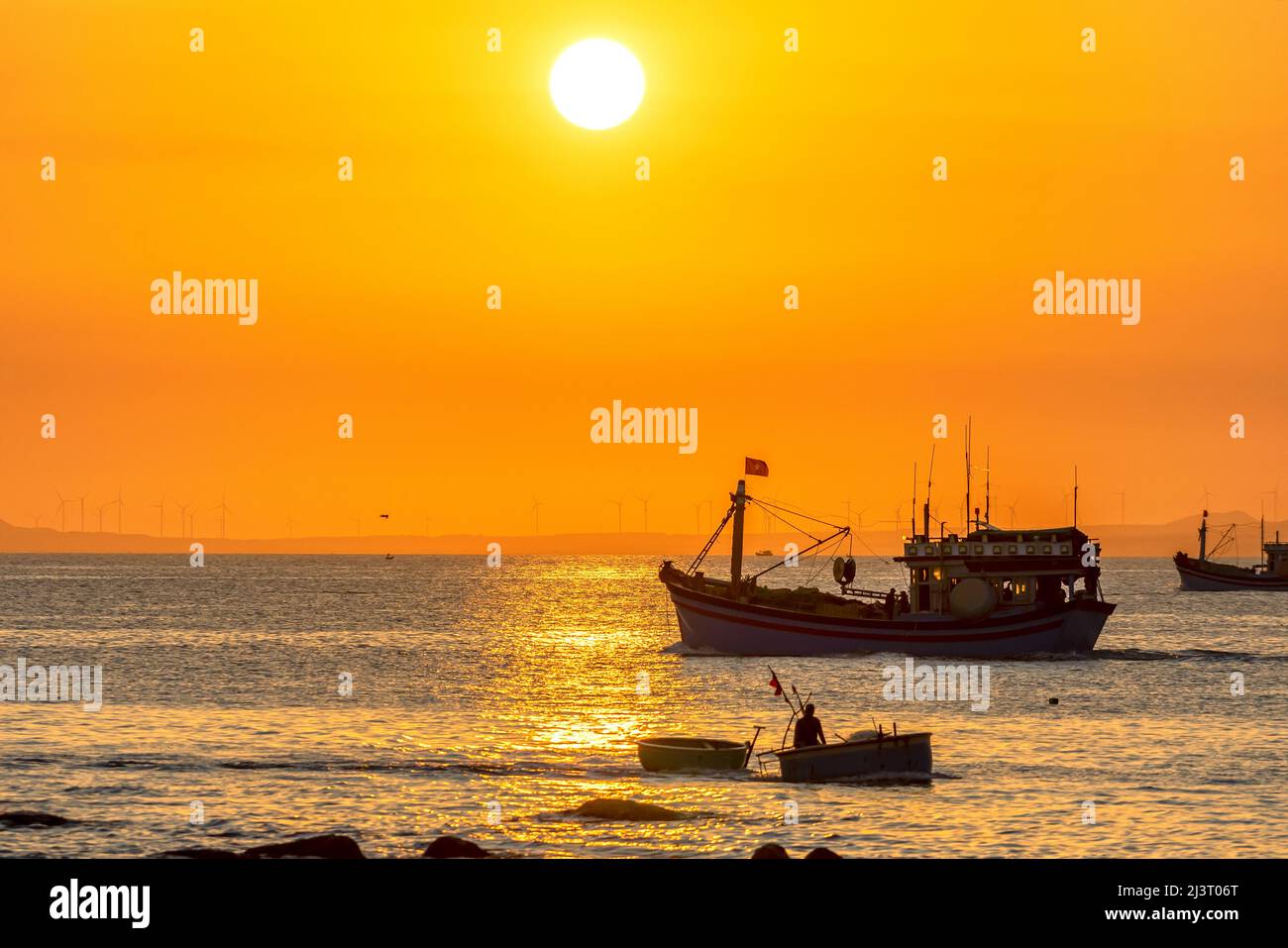 Sunset landscape when fishing boats out to sea to harvest fish end the ...