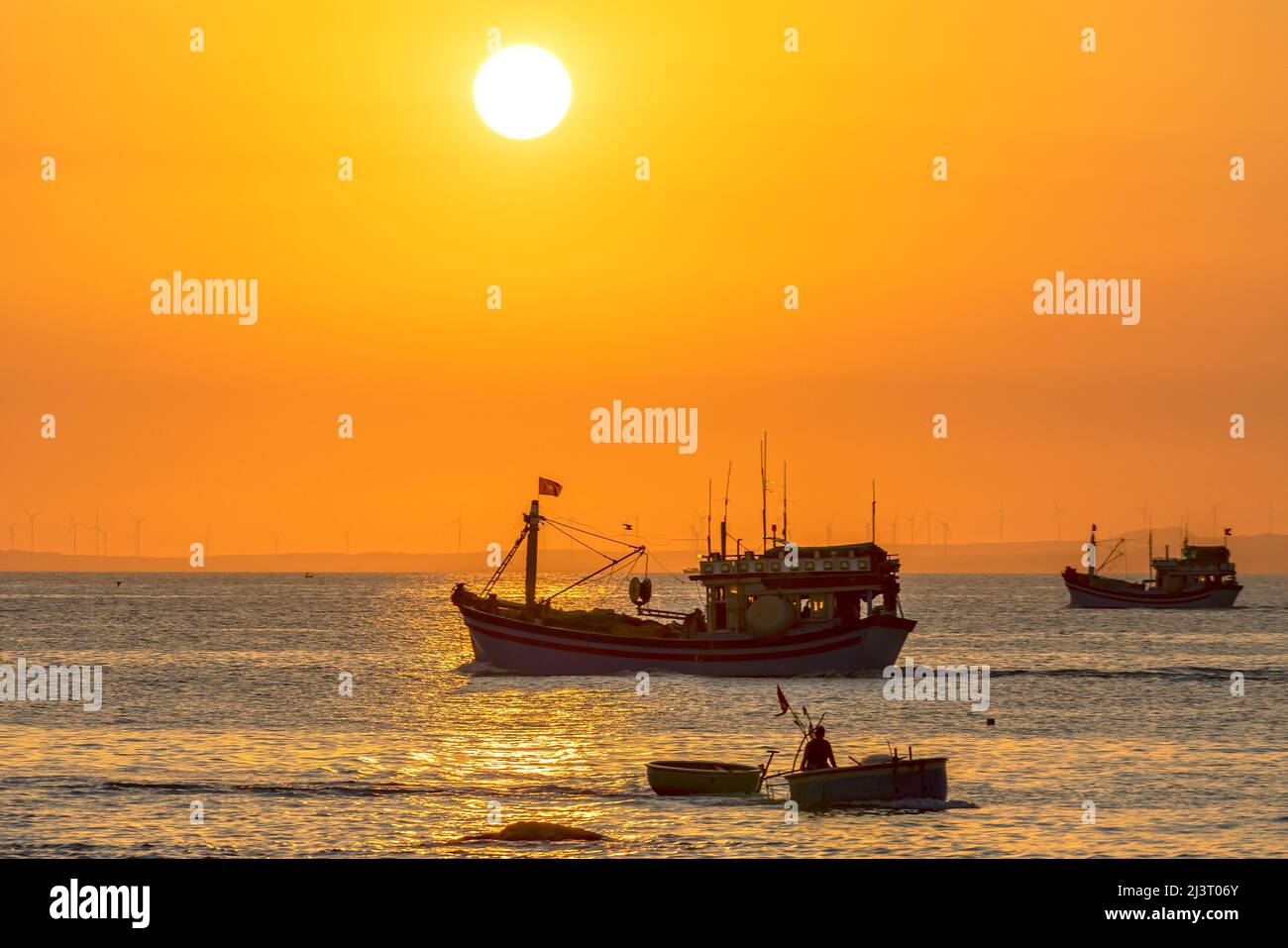 Sunset landscape when fishing boats out to sea to harvest fish end the ...