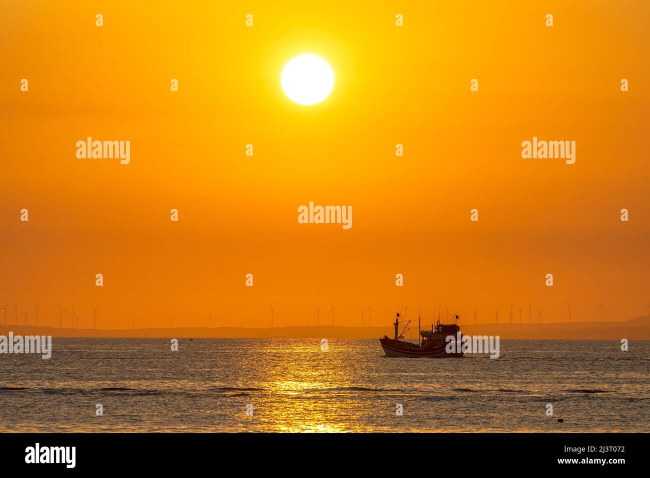 Sunset landscape when fishing boats out to sea to harvest fish end the ...