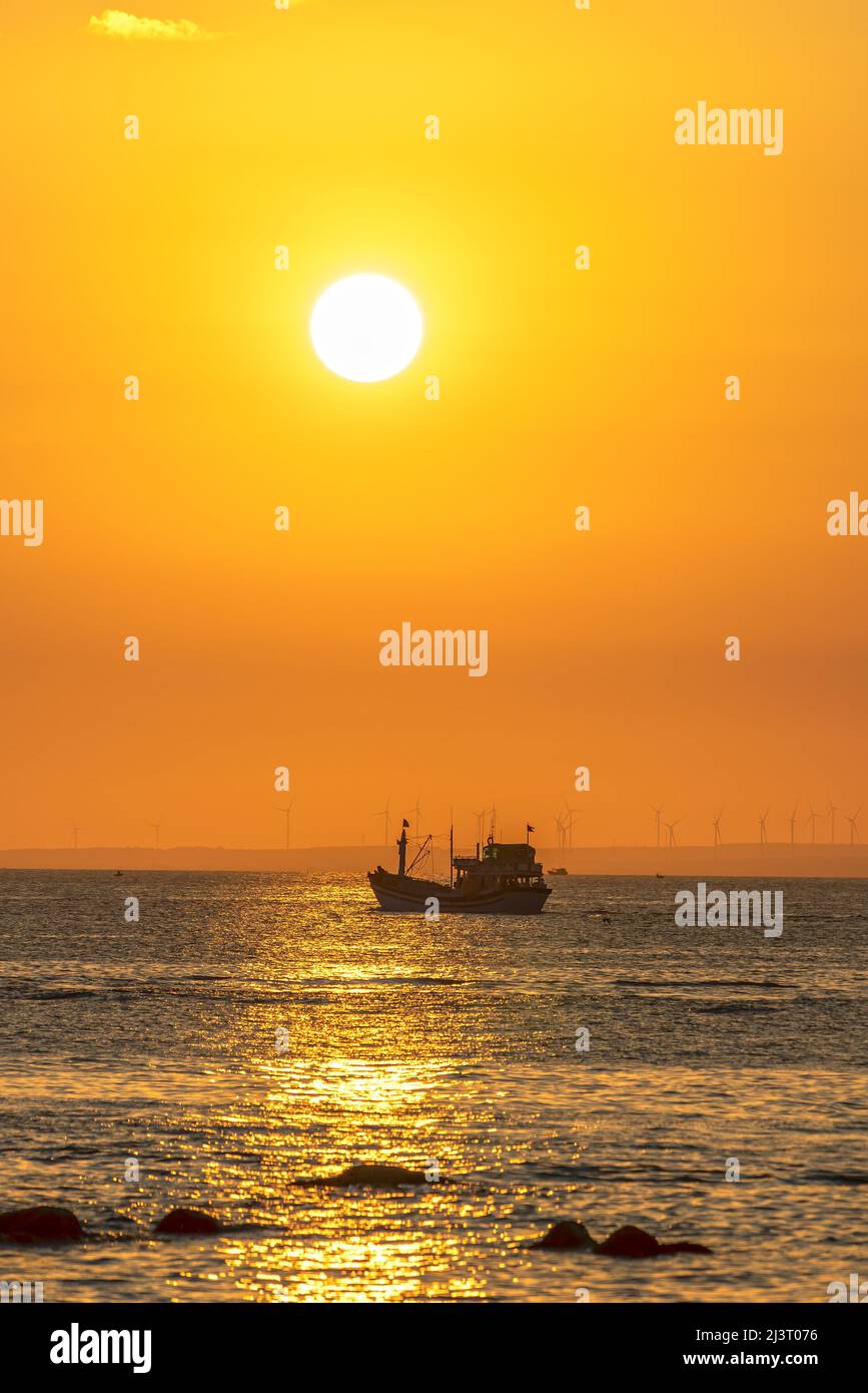 Sunset landscape when fishing boats out to sea to harvest fish end the ...