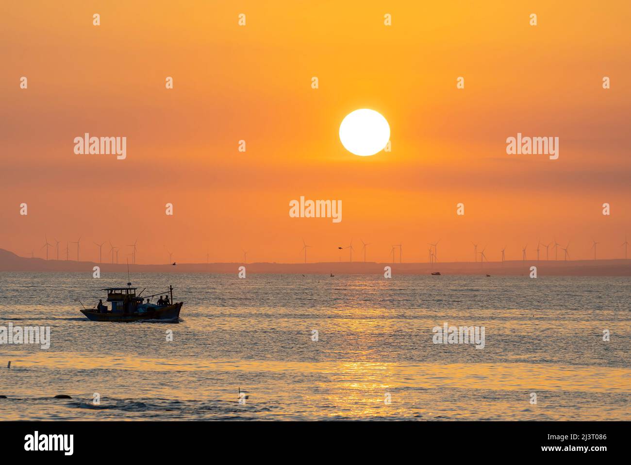 Sunset landscape when fishing boats out to sea to harvest fish end the ...