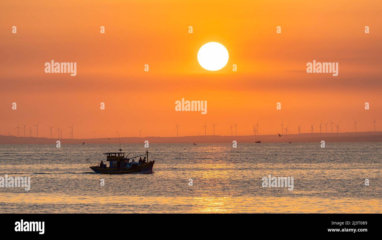 Sunset landscape when fishing boats out to sea to harvest fish end the ...