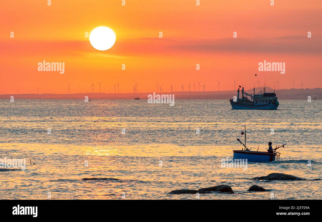 Sunset landscape when fishing boats out to sea to harvest fish end the ...
