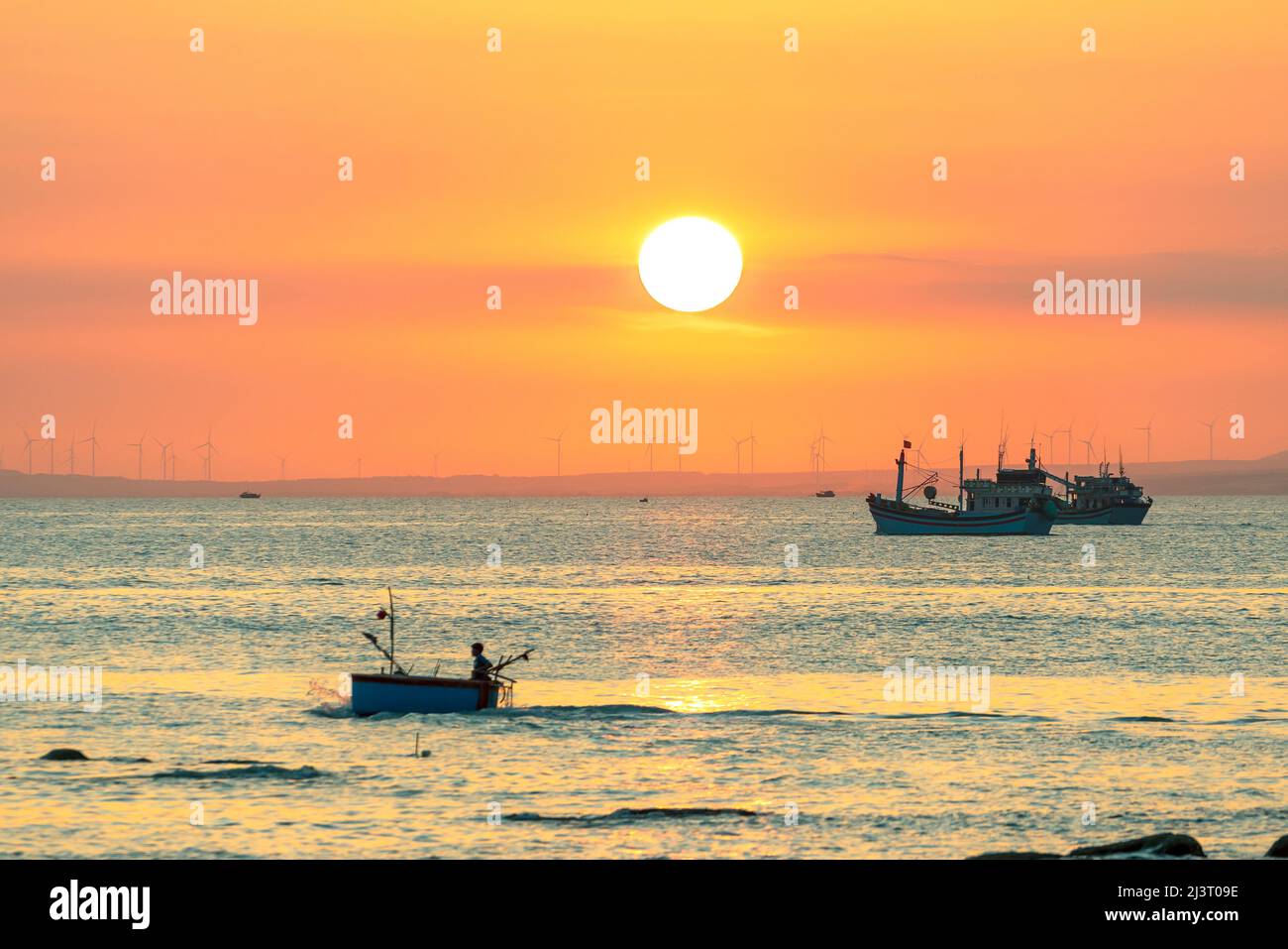 Sunset landscape when fishing boats out to sea to harvest fish end the ...