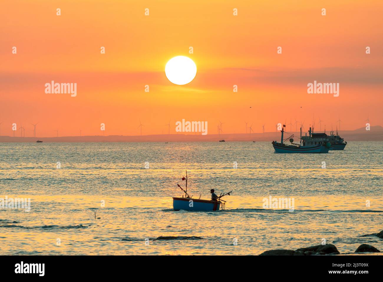 Sunset landscape when fishing boats out to sea to harvest fish end the ...
