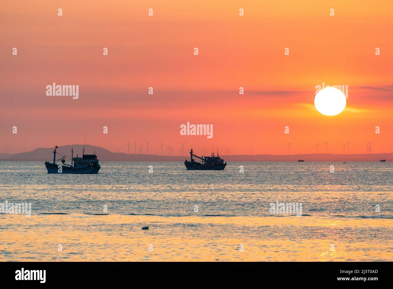Sunset landscape when fishing boats out to sea to harvest fish end the ...