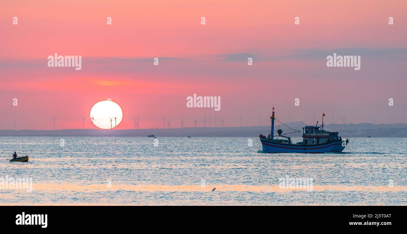 Sunset landscape when fishing boats out to sea to harvest fish end the ...