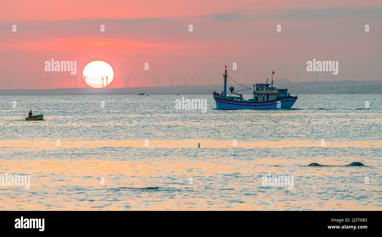 Sunset landscape when fishing boats out to sea to harvest fish end the ...
