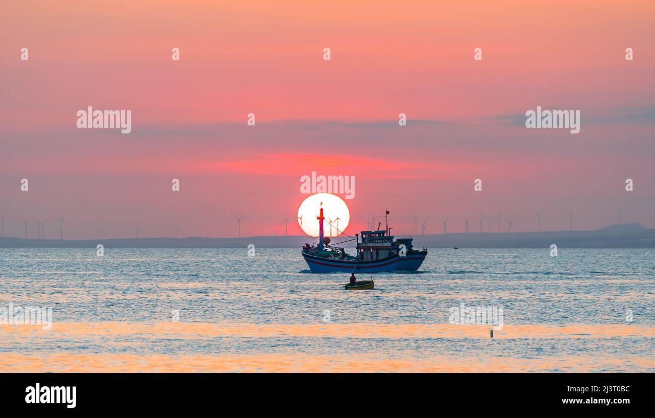 Sunset landscape when fishing boats out to sea to harvest fish end the ...