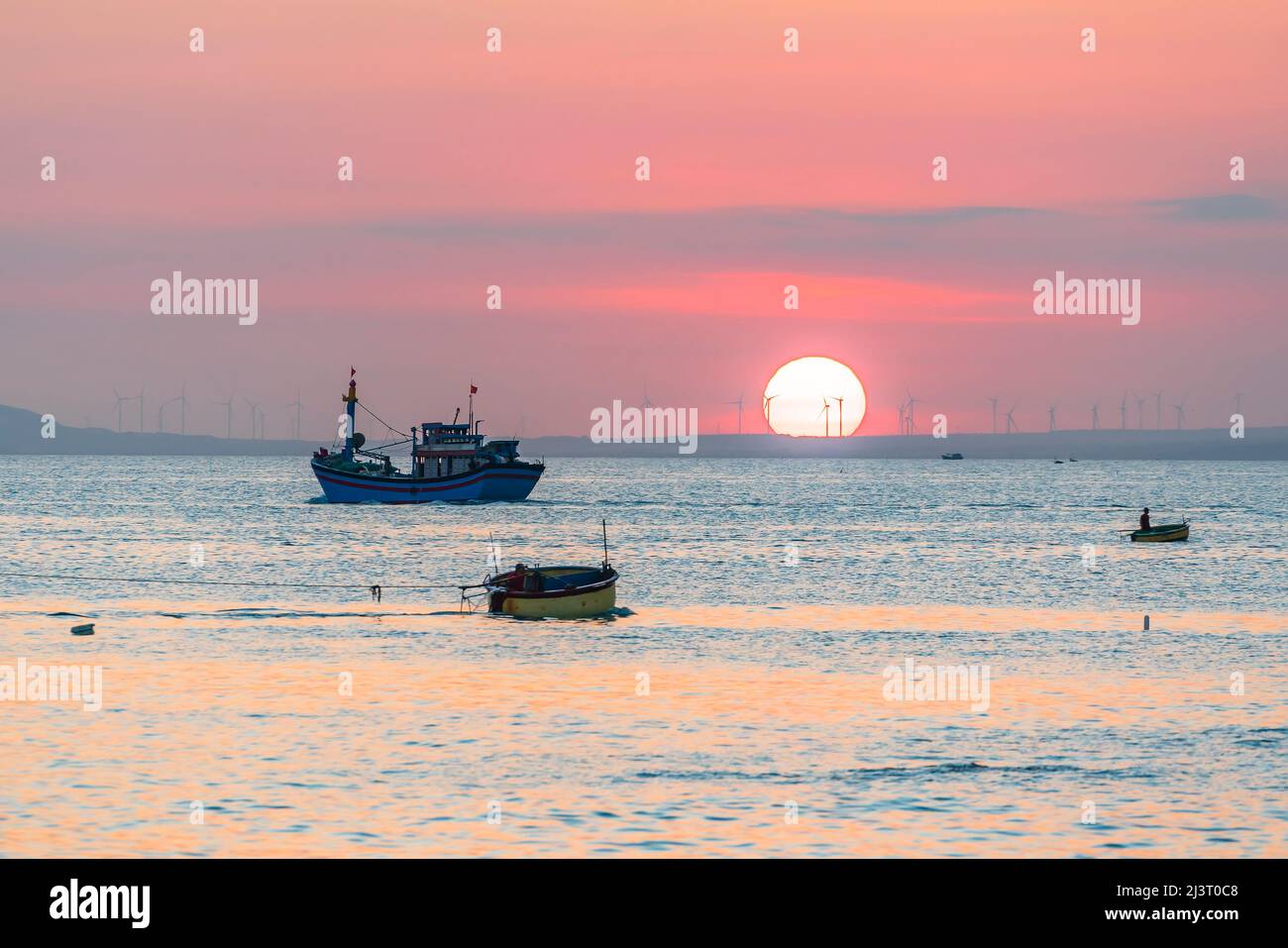 Sunset landscape when fishing boats out to sea to harvest fish end the ...