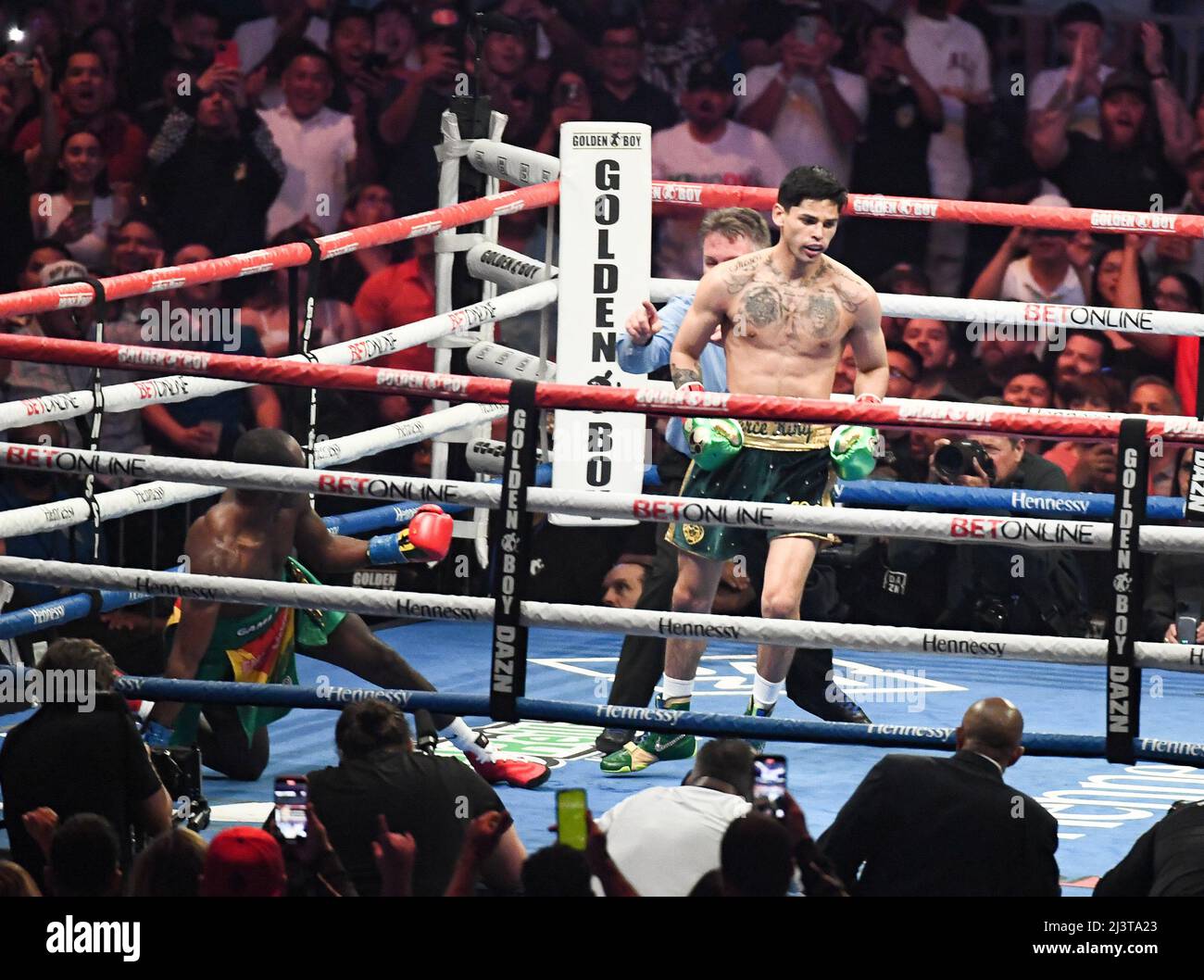 SAN ANTONIO, TX - APRIL 8: (R-L) Ryan Garcia knocks down Emmanuel Tagoe ...