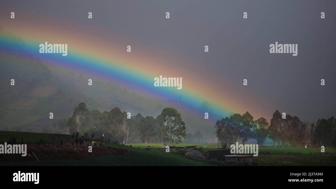 Beautiful rainbow over the farmlands and hills around Cerro Punta ...