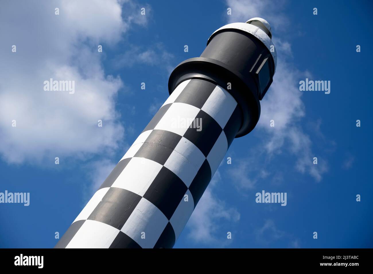 Lighthouse with black and white chequer design Stock Photo - Alamy
