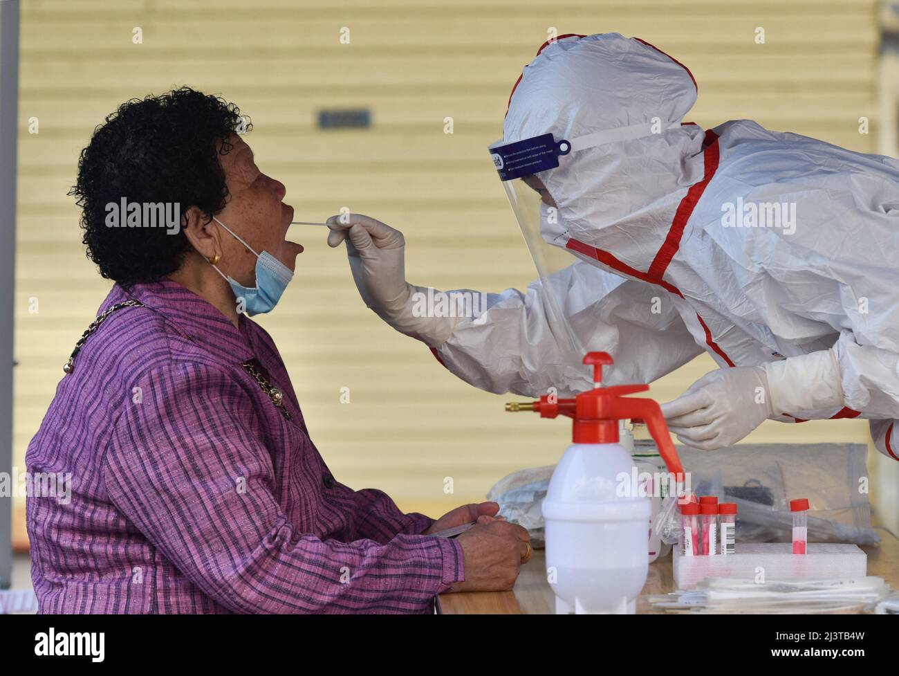 Fuyang, China. 10th Apr, 2022. A health worker wearing a Personal ...