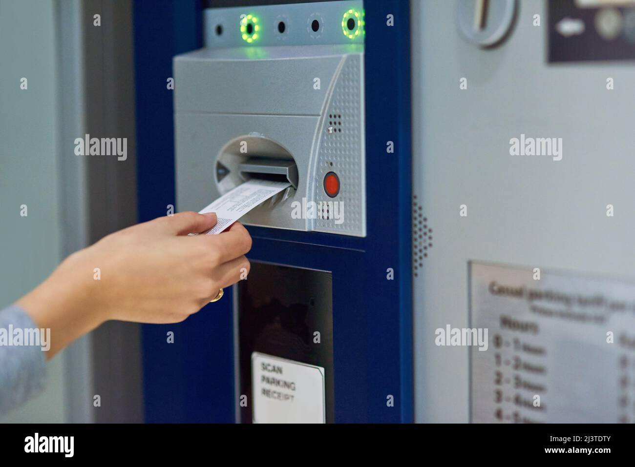 Pay or stay. Cropped shot of an unrecognizable person inserting a ...