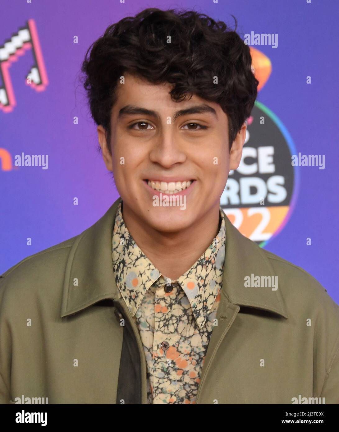 Christopher Martinez arrives at the 2022 Nickelodeon Kid's Choice Awards held at the Barker ...