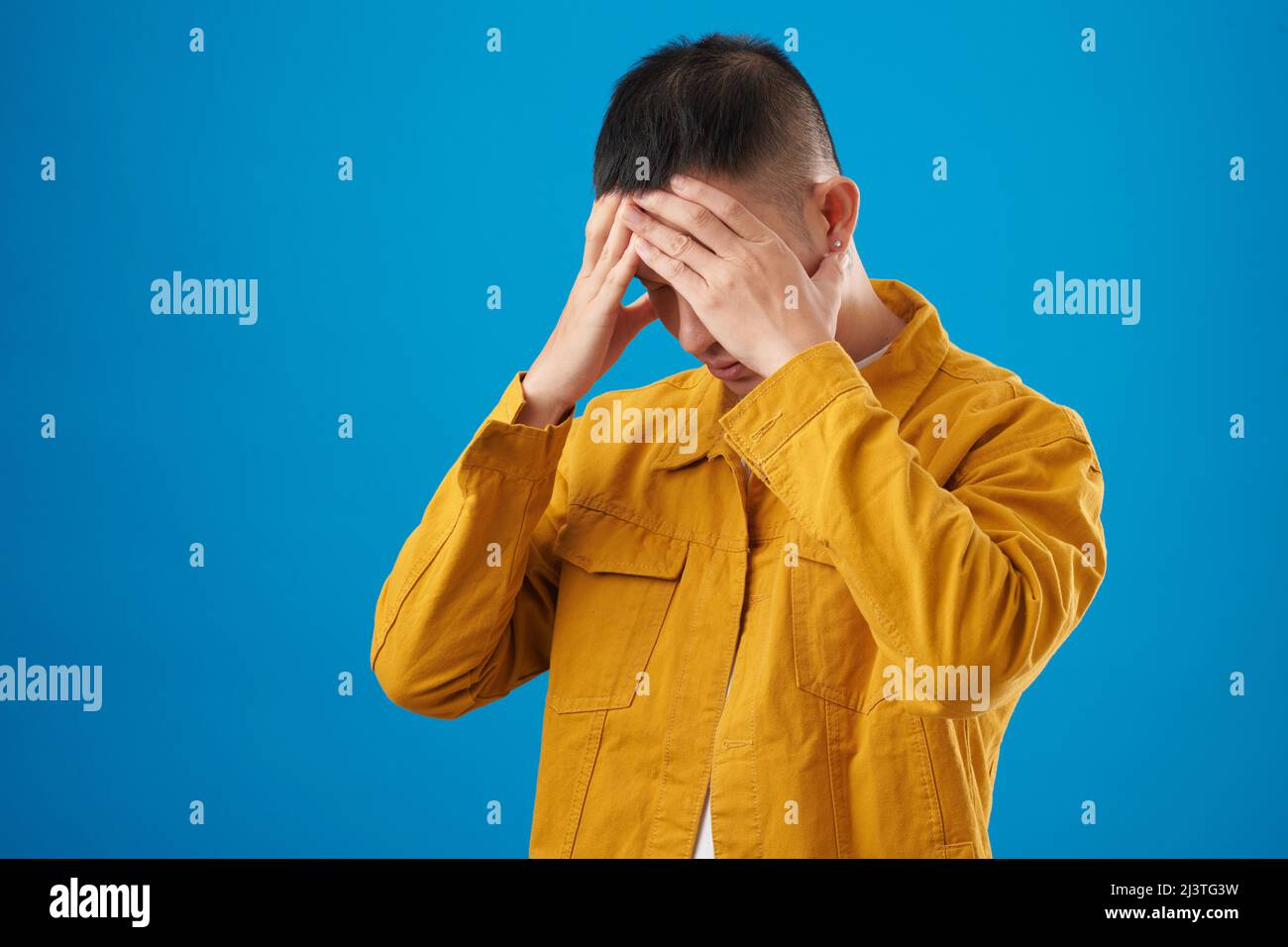 Portrait of stressed almost crying young man suffering from memories ...