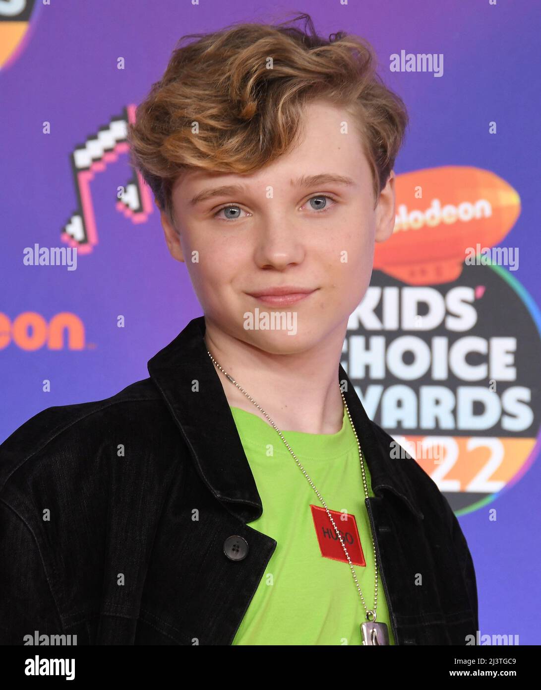 Asher Bishop arrives at the 2022 Nickelodeon Kid's Choice Awards held at the Barker Hangar in ...
