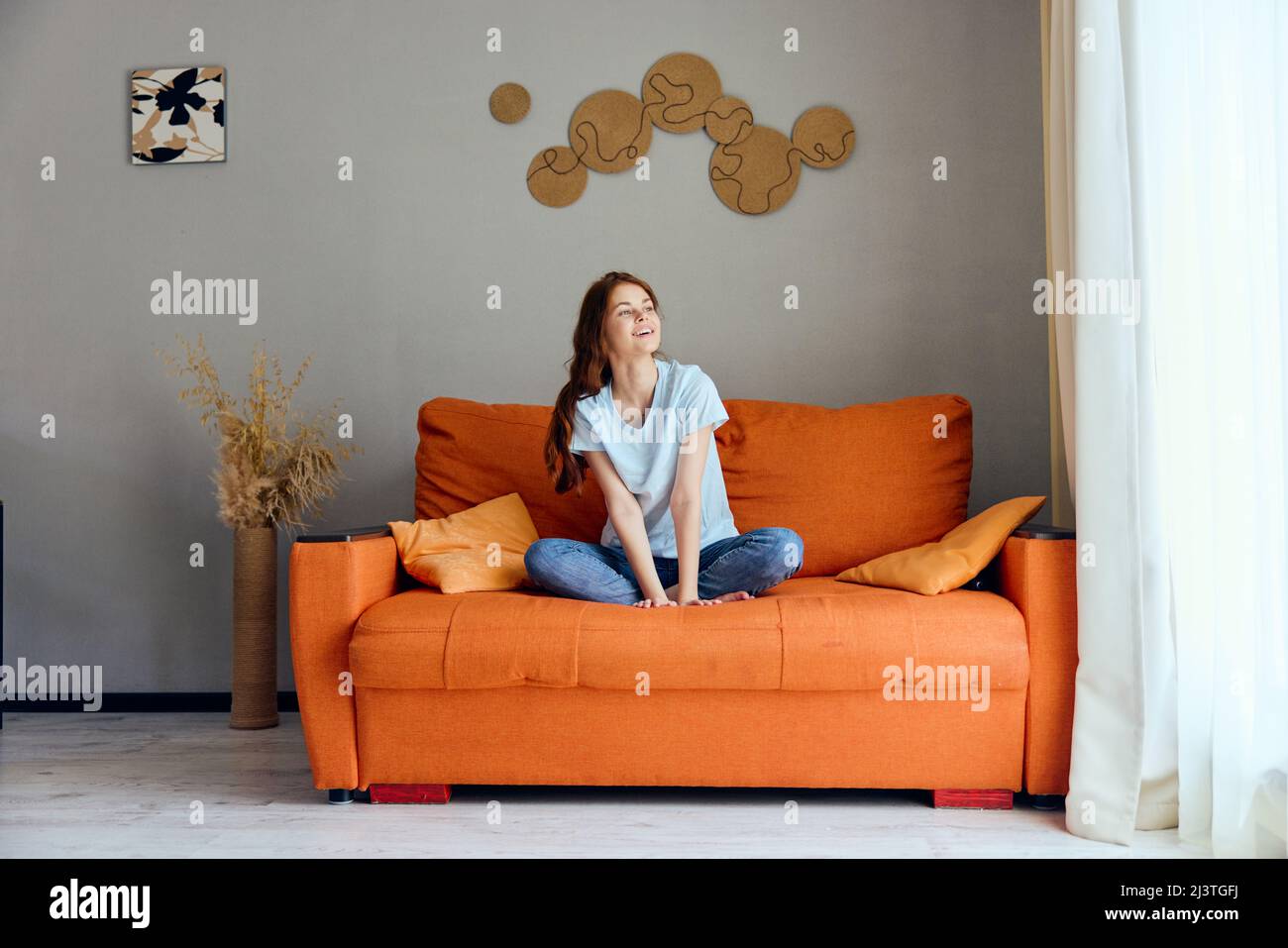 beautiful woman on the couch rest fun Comfort apartments Stock Photo ...